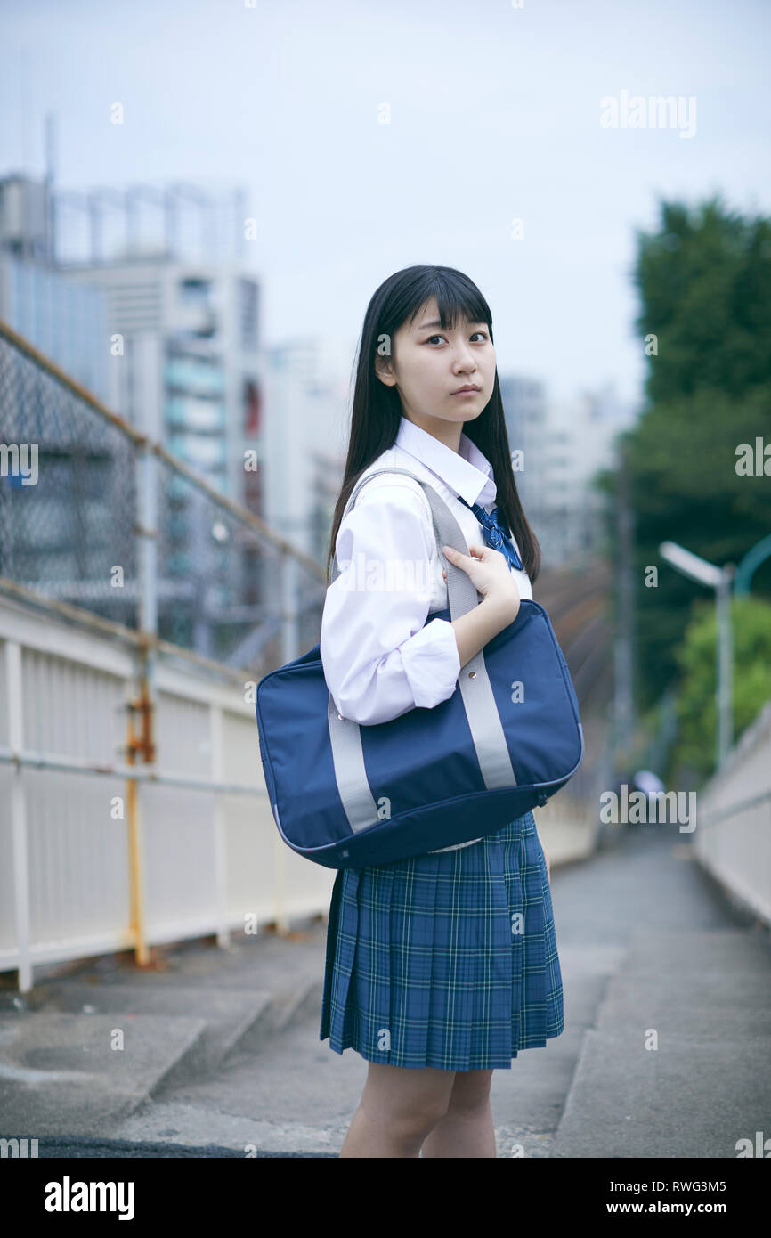 Japanese high school student in uniform downtown Tokyo Stock Photo - Alamy
