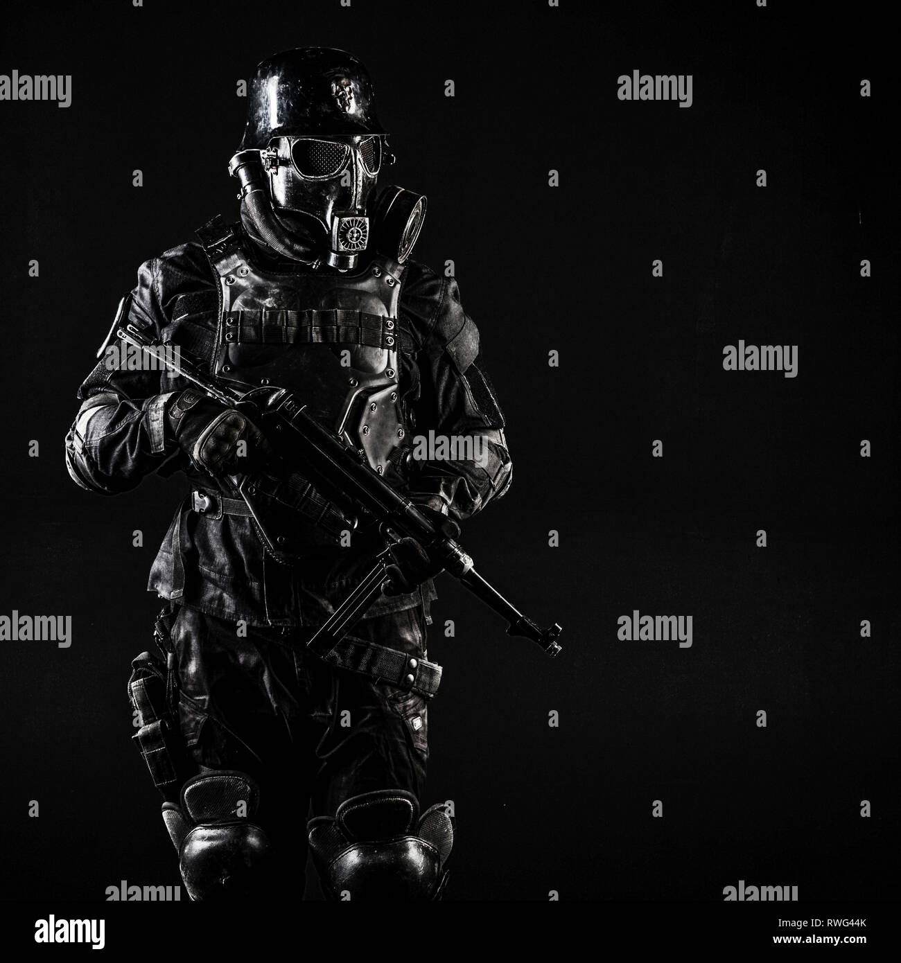 Futuristic Nazi soldier with submachine gun on dark background Stock ...