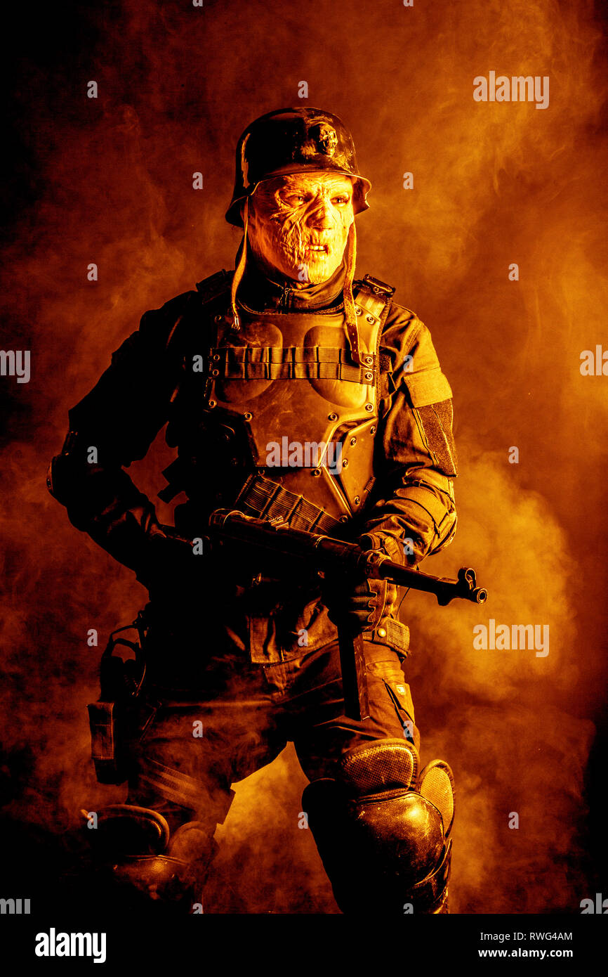 Ugly burnt face of futuristic Nazi soldier wearing a steel helmet Stock ...