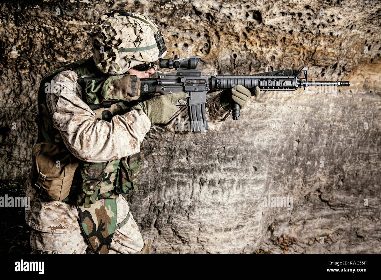 U.S. Marine Corps soldier in action among the rocks Stock Photo - Alamy