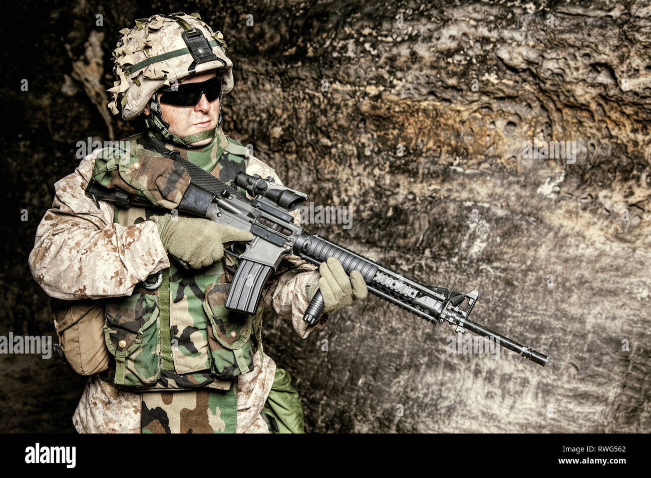 U.S. Marine Corps soldier in action among the rocks Stock Photo - Alamy