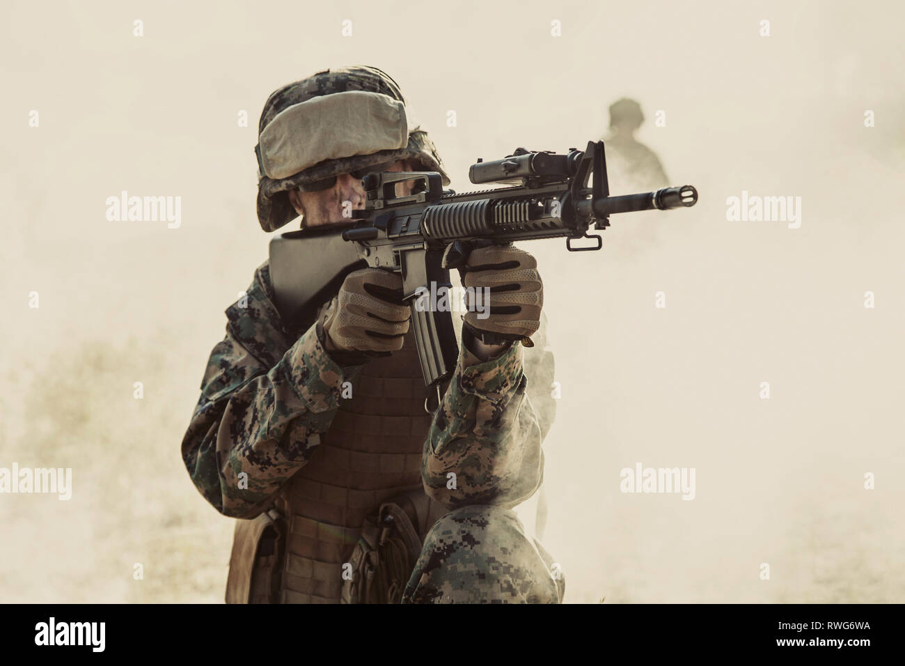 U.S. Marines in action on a smoke filled battlefield Stock Photo - Alamy