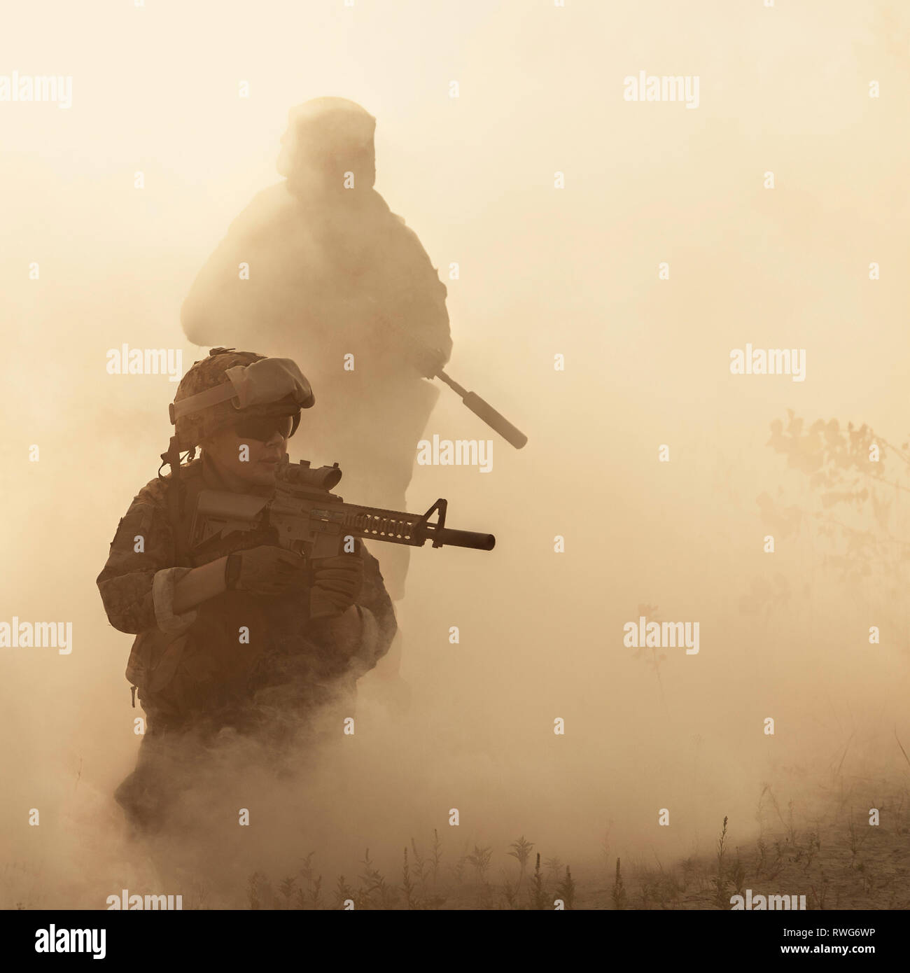 U.S. Marines in action on a smoke filled battlefield Stock Photo - Alamy