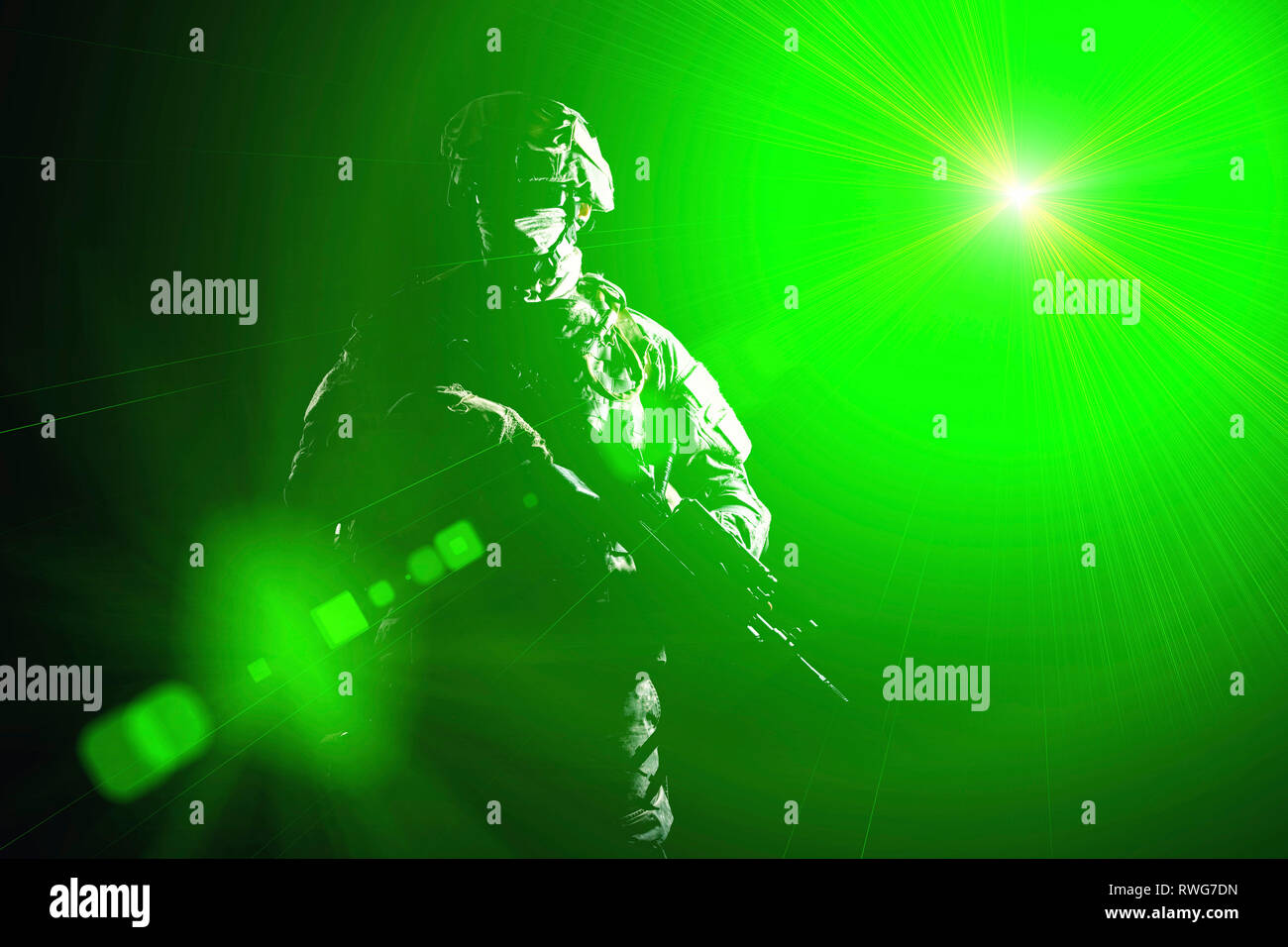 U.S. Marine raider armed with carbine assault rifle in blinding light ...