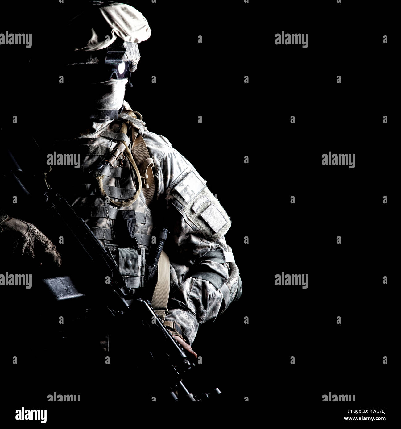 Army soldier with hidden face under the cover of darkness Stock Photo ...