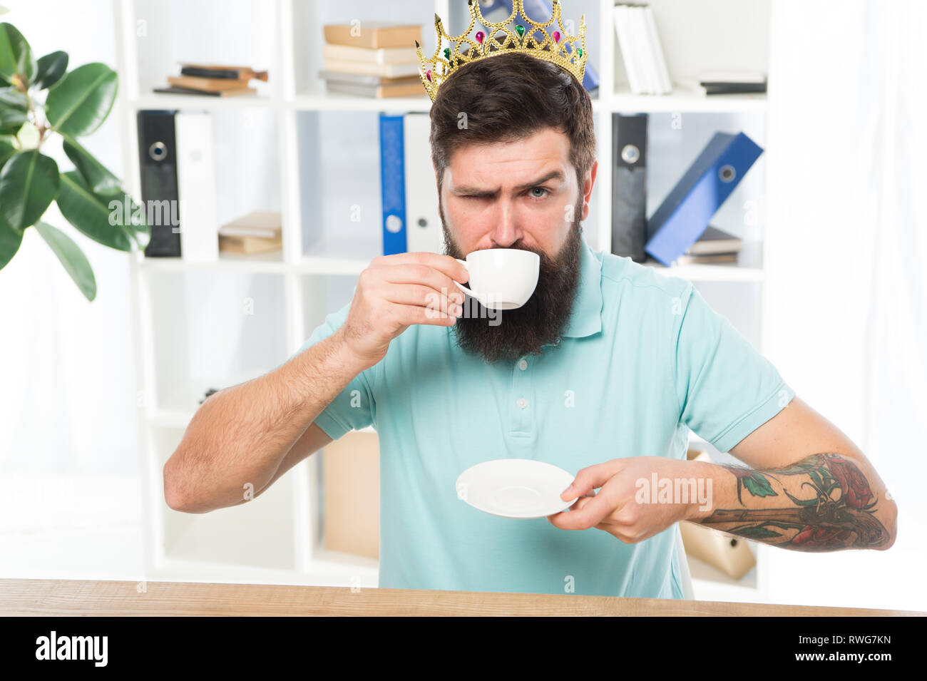 Relaxed top manager drinking coffee. Confident boss enjoying his glory ...