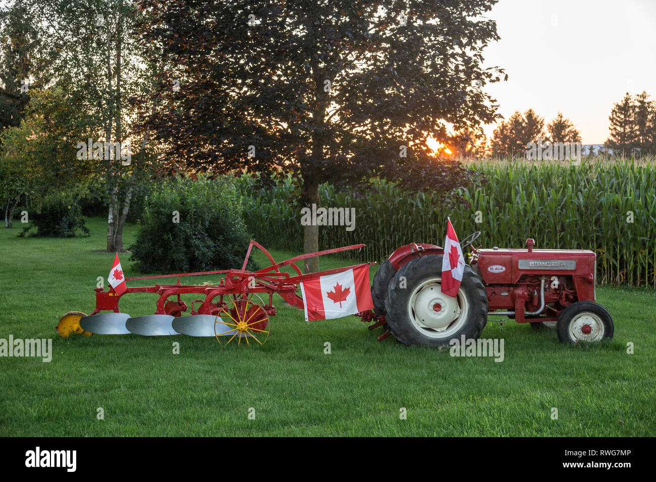 Tractor and old plough decorated with Canadian flags, Clinton, Ontario ...