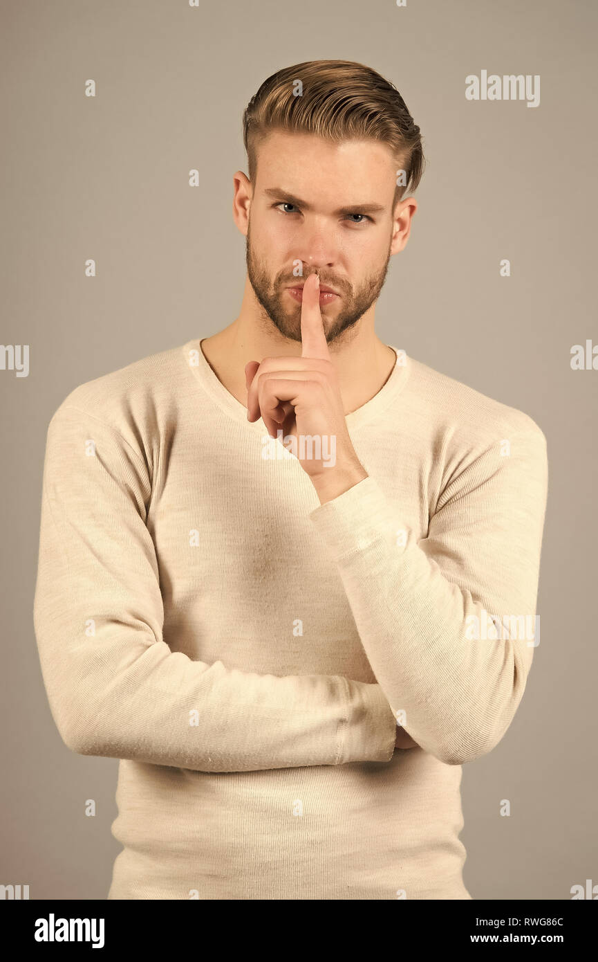 Keep silence. Man handsome attractive silence gesture. You better keep ...