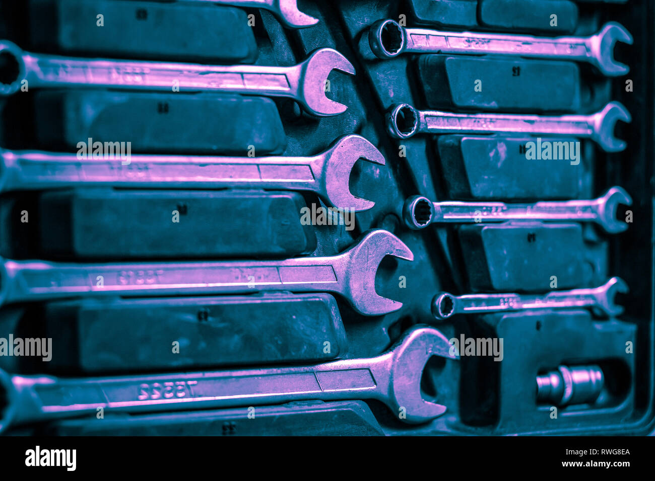 Flat Lay metal wrenches of various sizes are in the tool box, top view ...