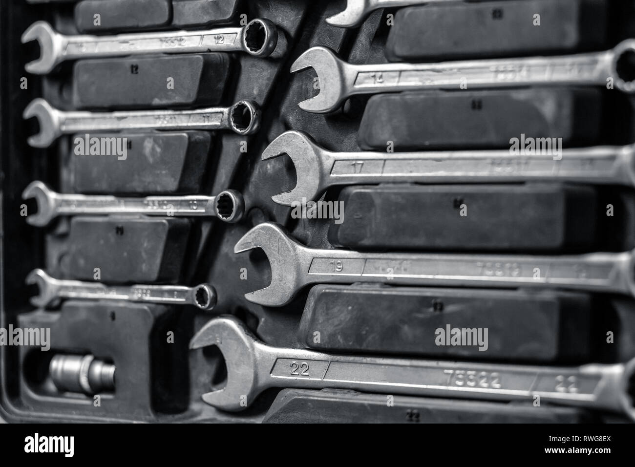 Flat Lay metal wrenches of various sizes are in the tool box, top view ...