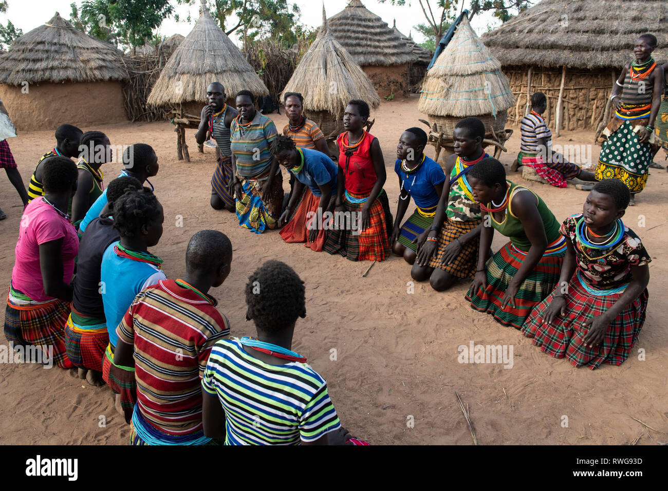 Traditional game playing in a Karamojong village, northern Uganda Stock ...