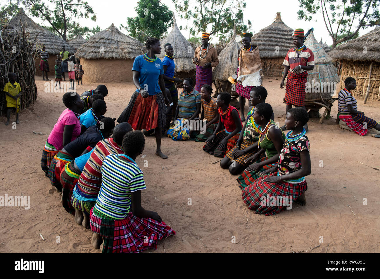 Traditional game playing in a Karamojong village, northern Uganda Stock ...