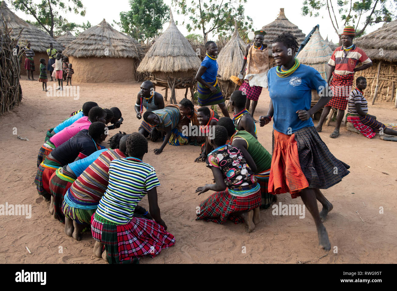 Traditional game playing in a Karamojong village, northern Uganda Stock ...
