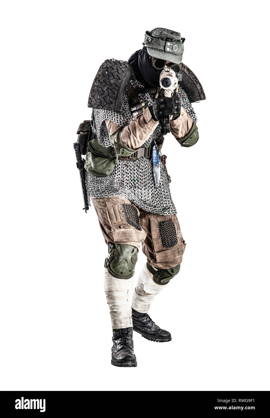 Post apocalyptic soldier wearing handmade armor, aiming submachine gun ...