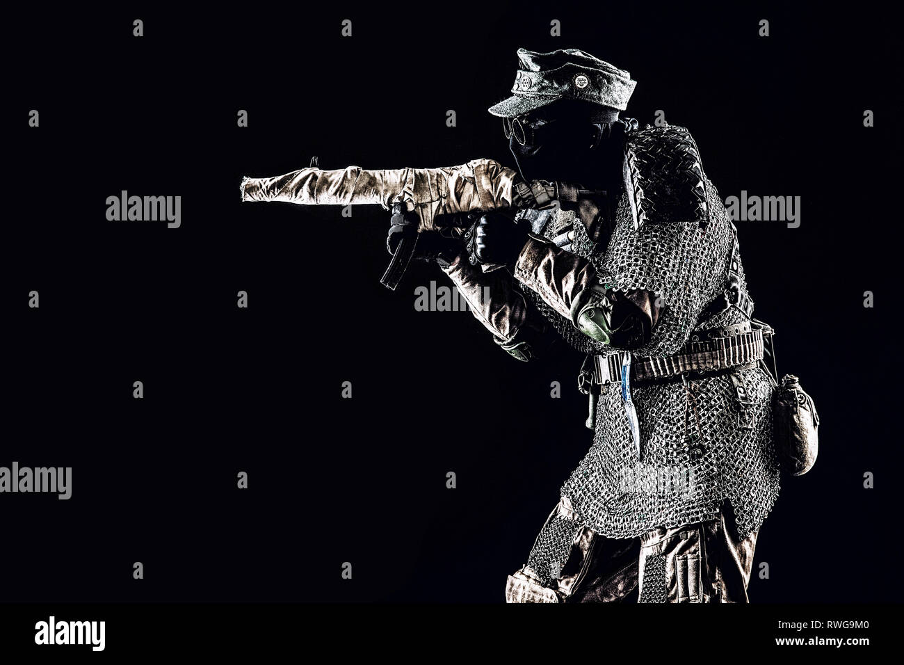 Post apocalypse soldier in handmade armor aiming submachine gun Stock ...