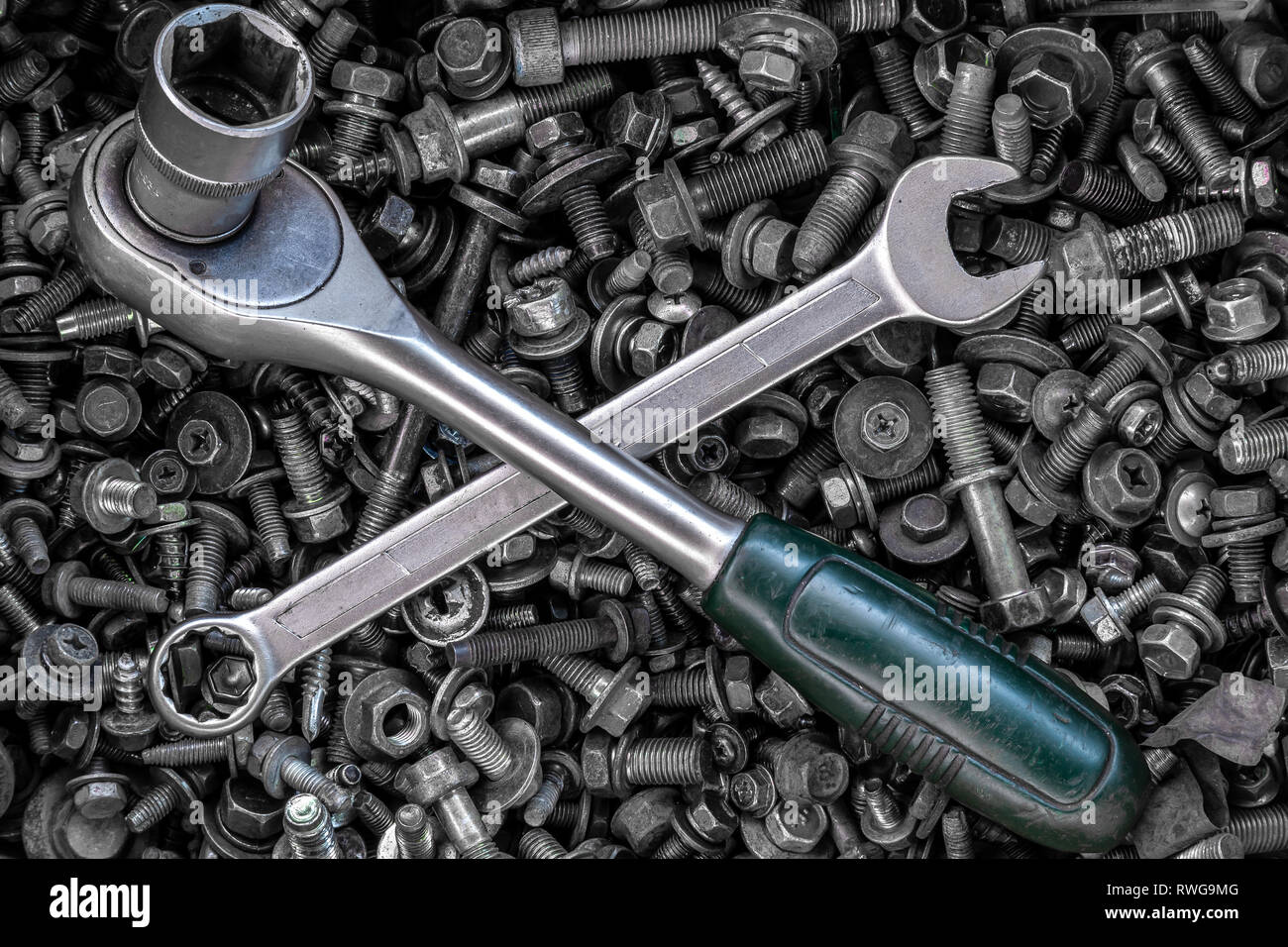 Flat Lay metal wrenches and ratchet of different sizes lie on the ...