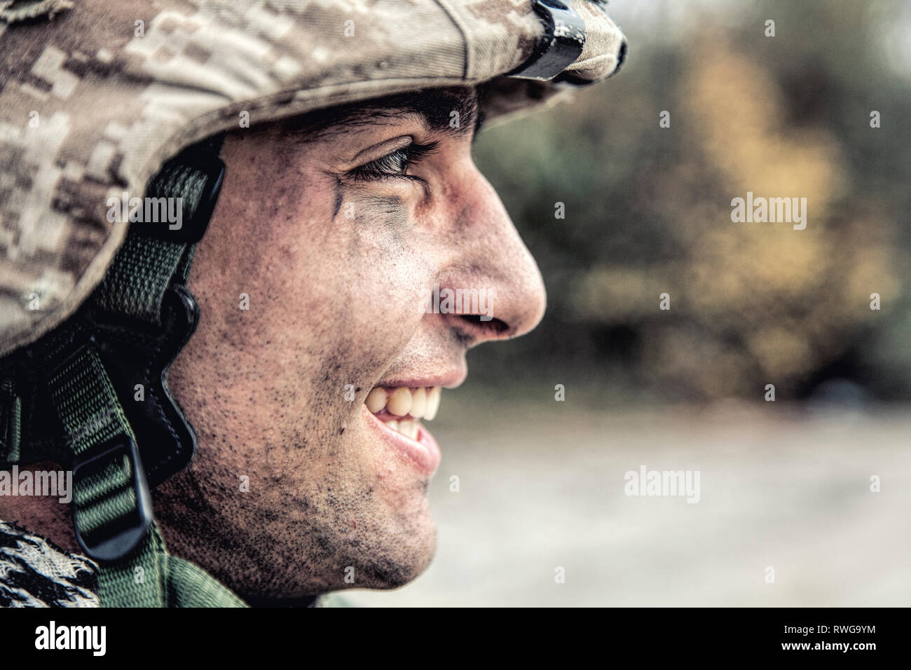 Shoulder portrait of a happy smiling young U.S. Army soldier in battle ...