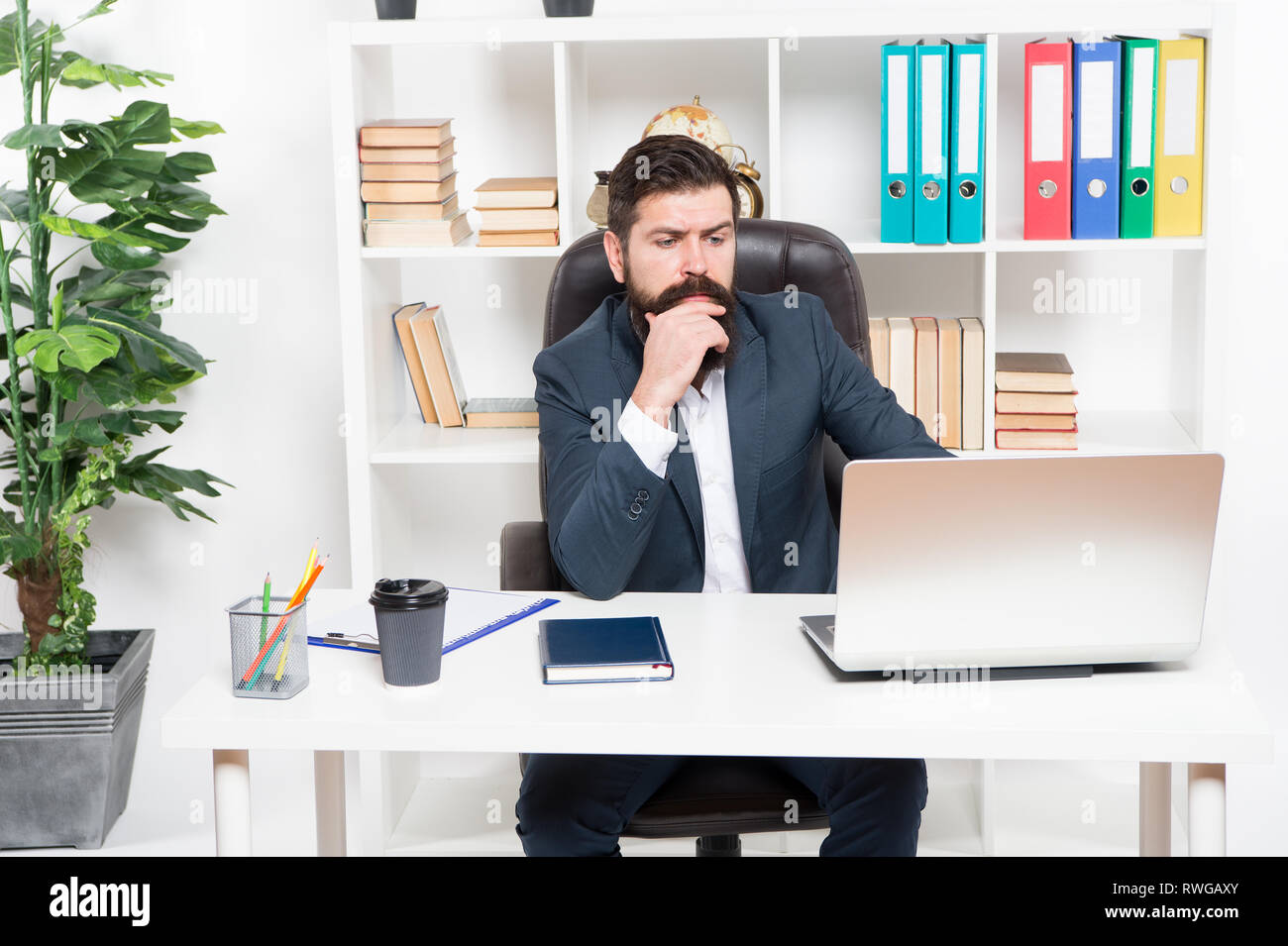 Broker tracks financial indicators. Man bearded hipster boss sit in ...