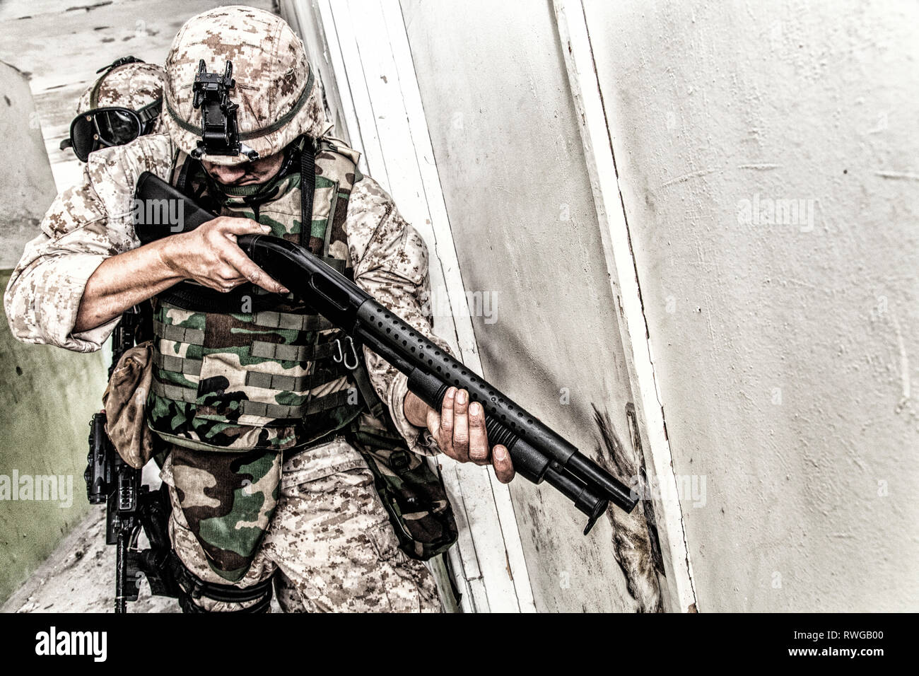 Marine assault team clearing rooms in an abandoned building Stock Photo ...