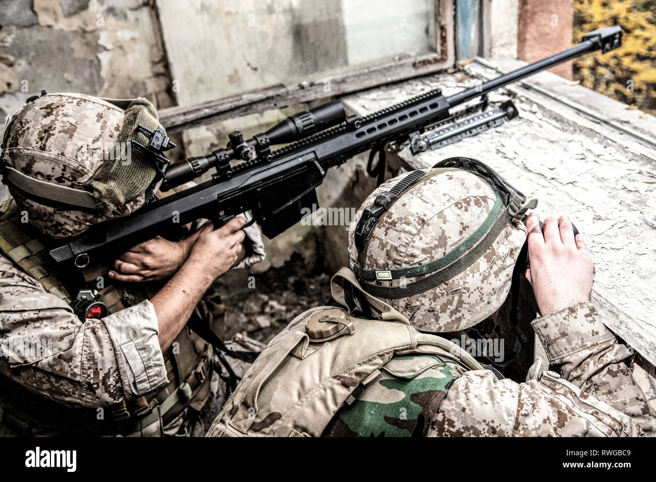 Sniper team shooting enemy targets with sniper rifle from inside a ...