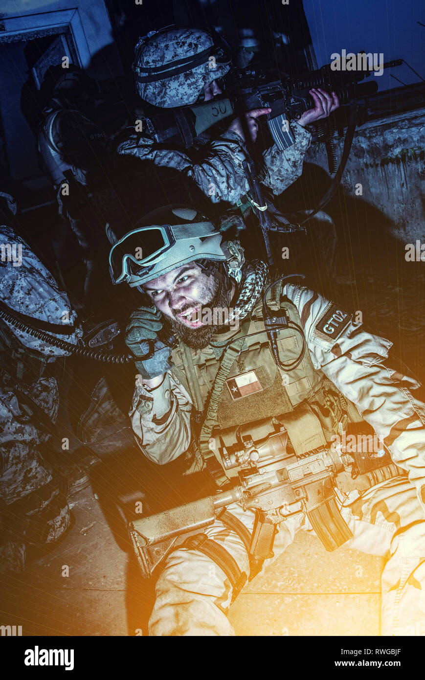 Commando team leader screaming in radio handset during an intensive ...