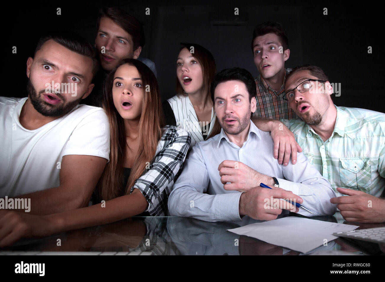 surprised business team looking at the computer monitor Stock Photo - Alamy