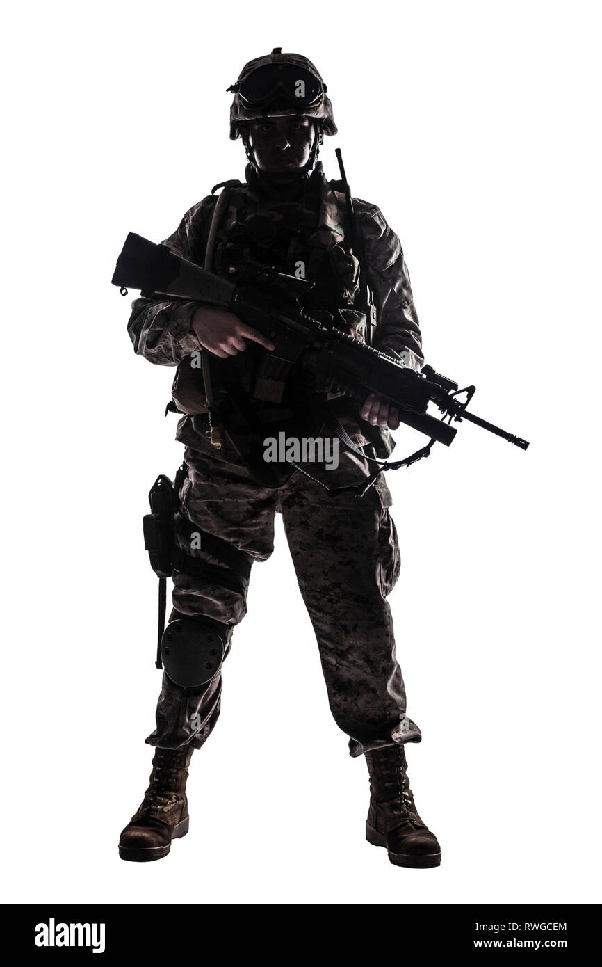 Army infantryman armed with assault rifle attached with underbarrel ...