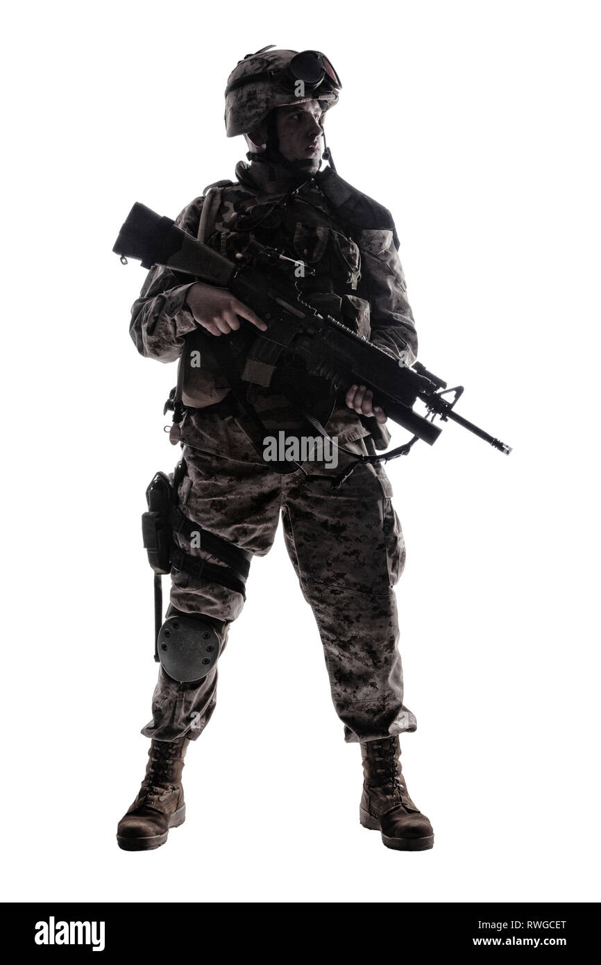 Army infantryman armed with assault rifle attached with underbarrel ...