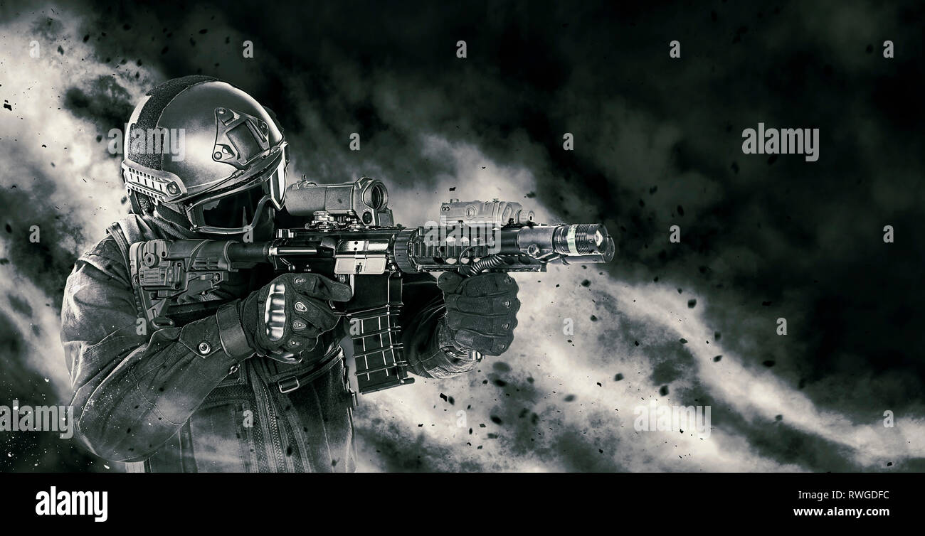 Spec ops police officer SWAT making his way through the fire with rifle ...