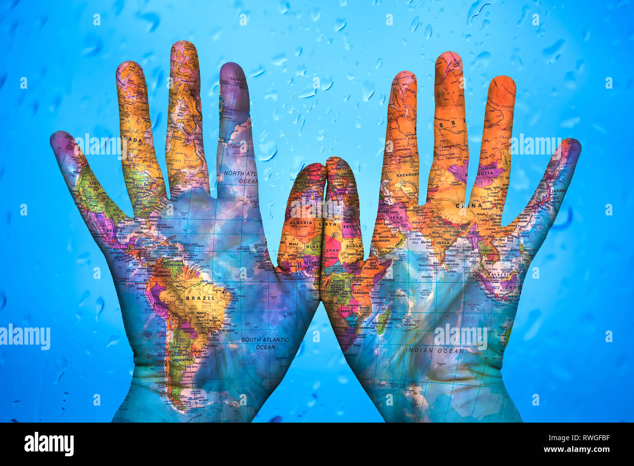 the map of the world on hands Stock Photo - Alamy