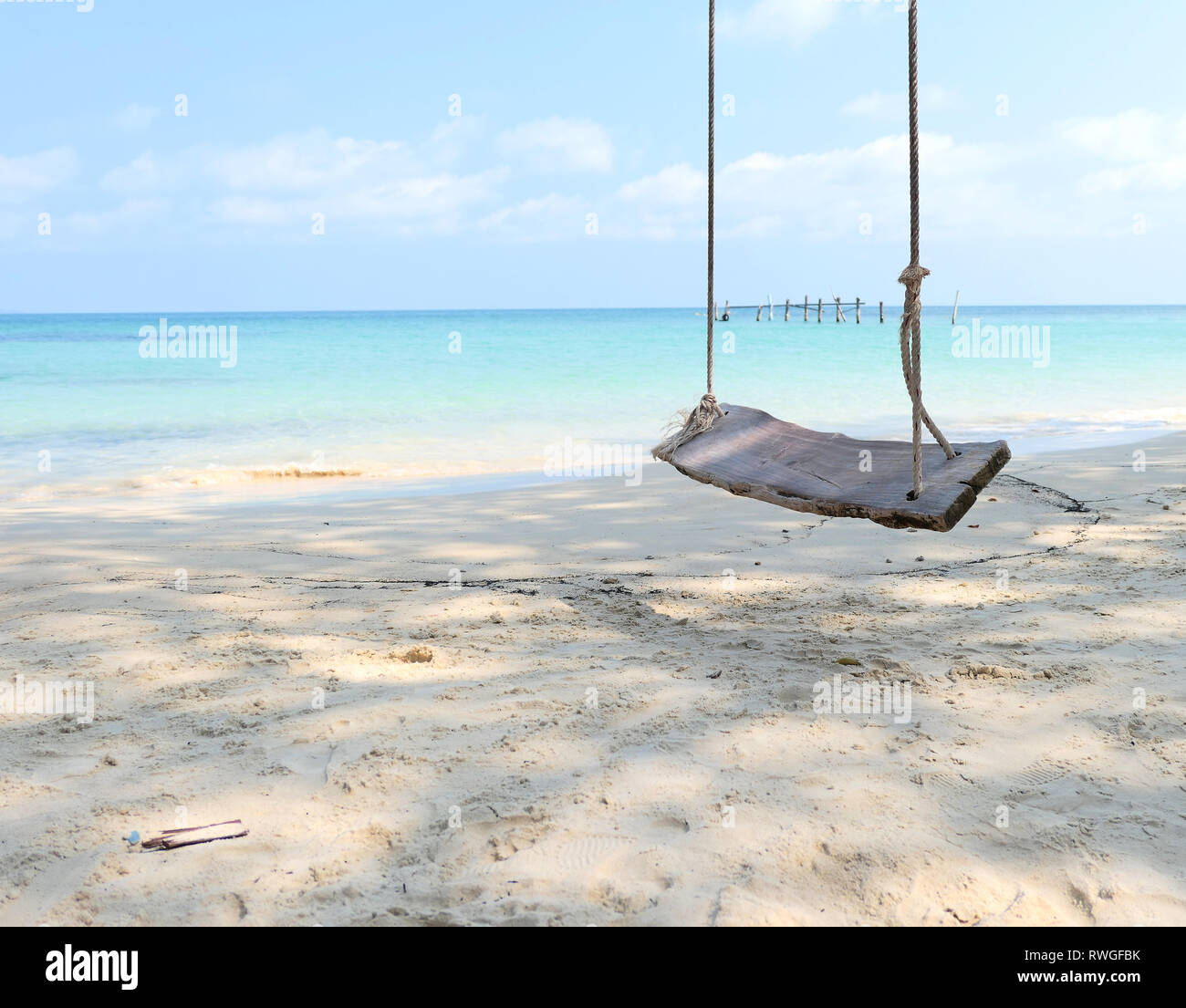 Swing on the beach Stock Photo - Alamy