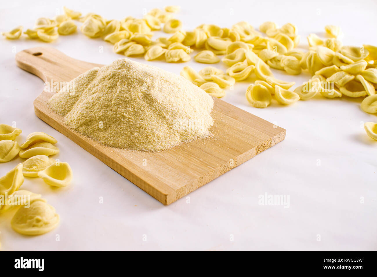 Close-up of orecchiette of typical italian handmade pasta with a pile ...