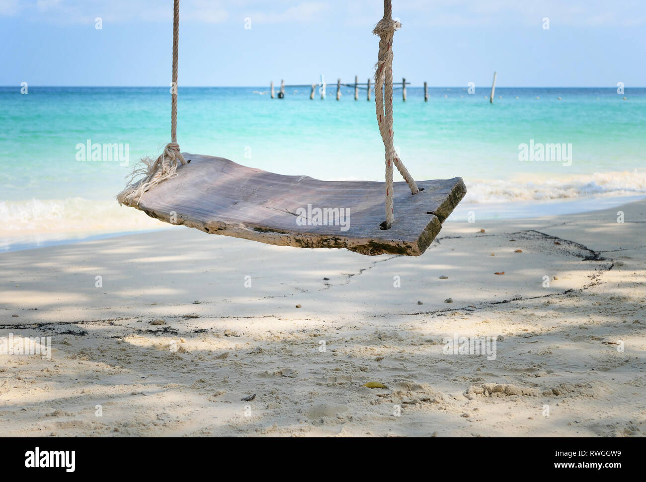Swing on the beach Stock Photo - Alamy