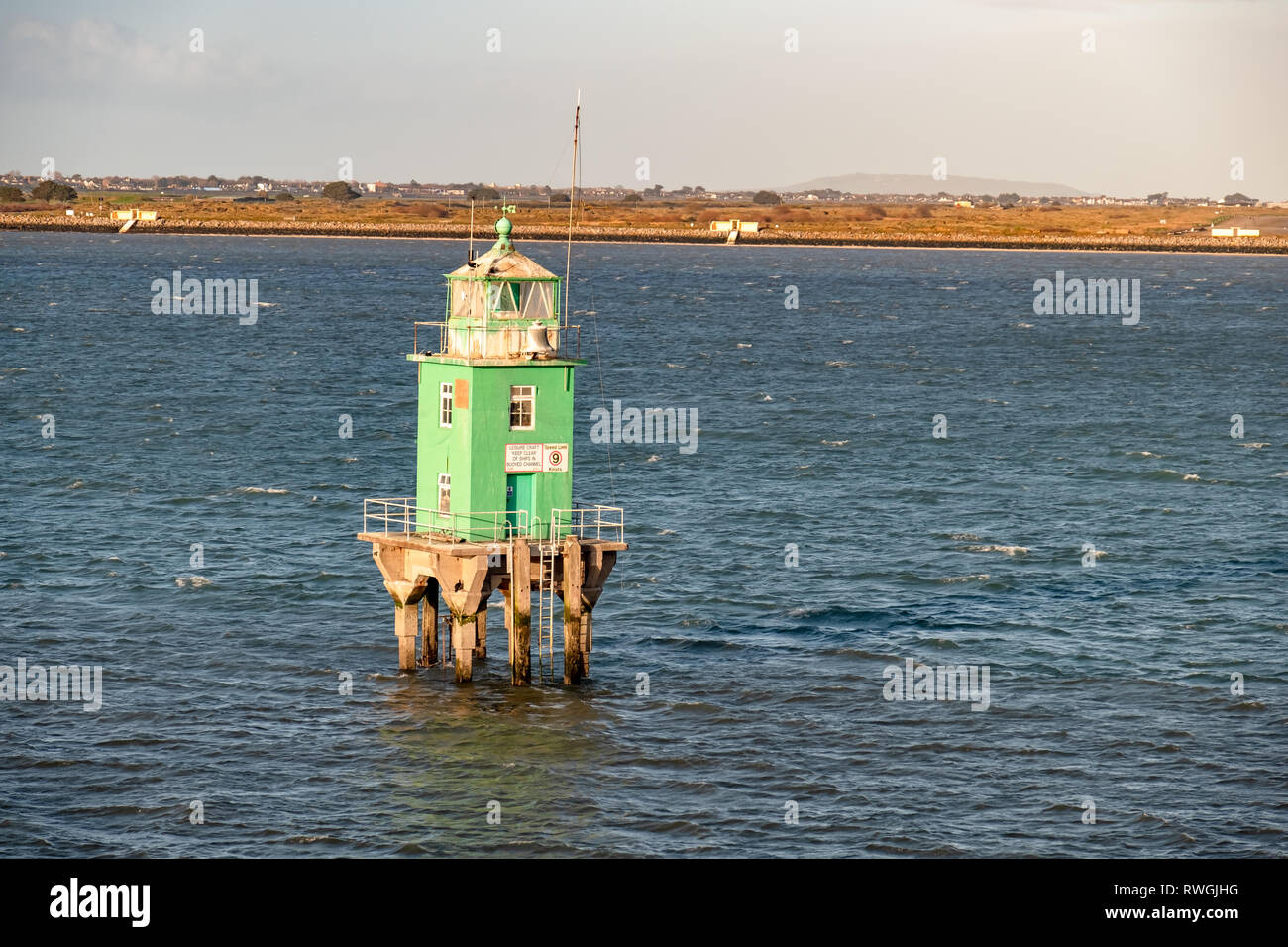 Green buoy tower lighthouse at Dublin harbour Stock Photo - Alamy