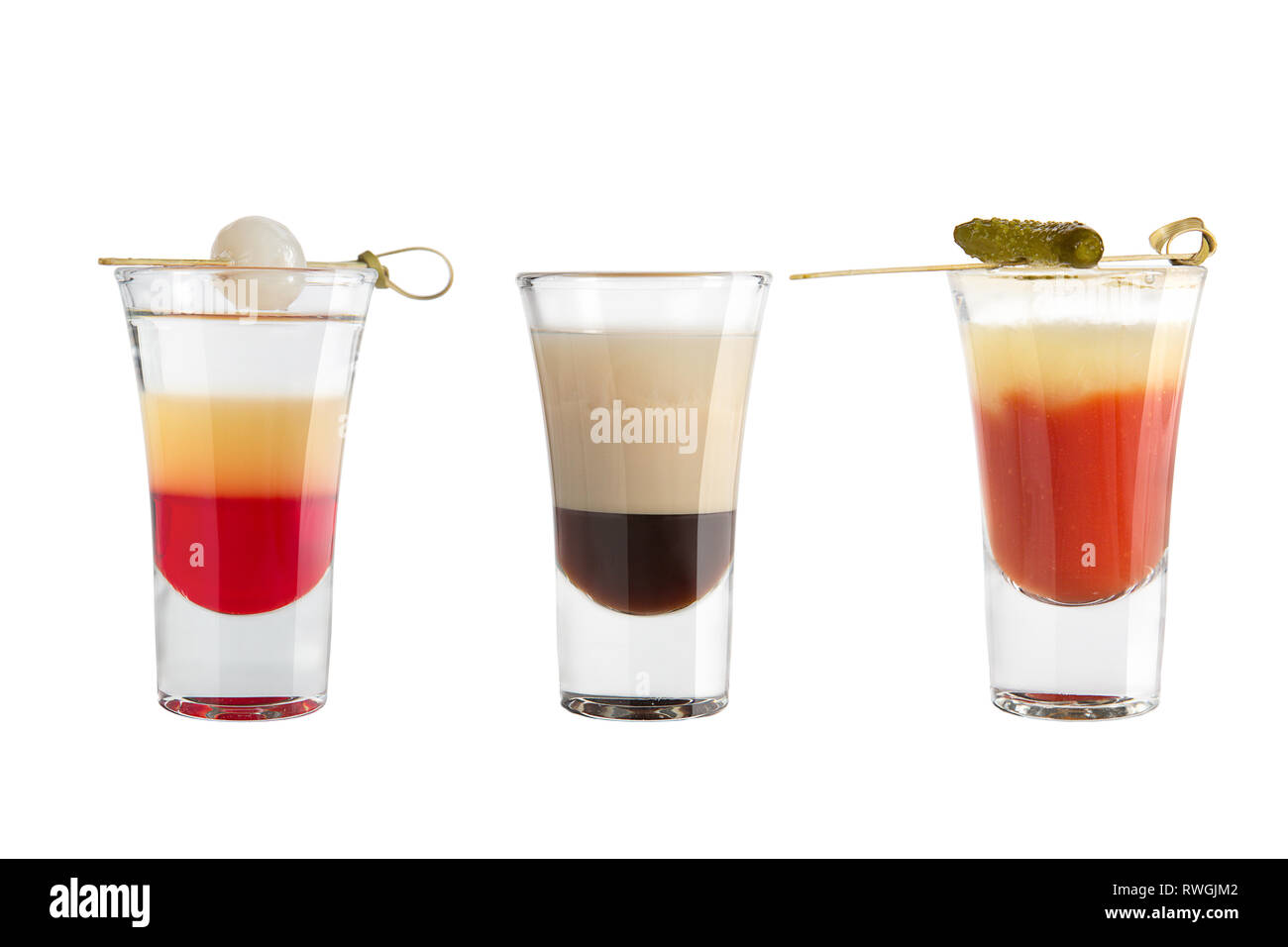Popular alcohol shots on a white background. Three shots and decoration ...