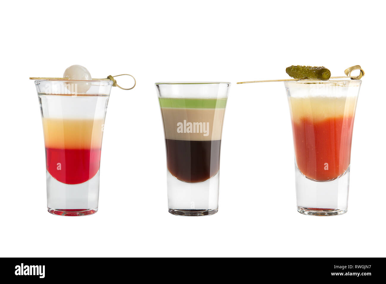 Popular alcohol shots on a white background. Three shots with ...