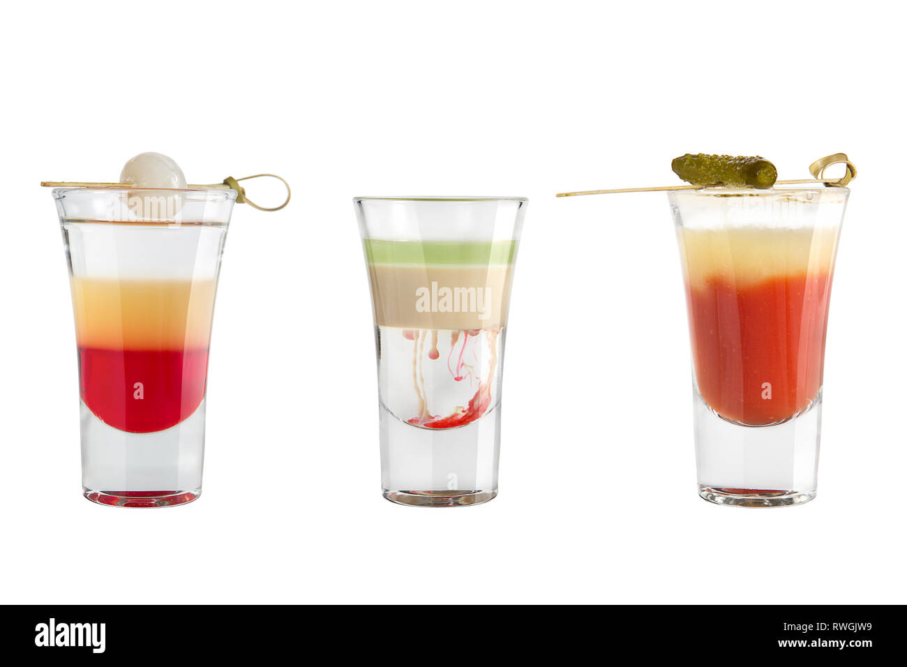 Popular alcohol shots on a white background. Three different alcohol ...