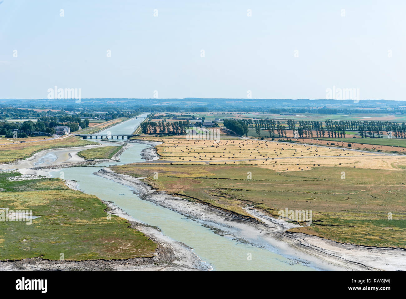 View of the river Couesnon and the barrage for tide control in the bay ...