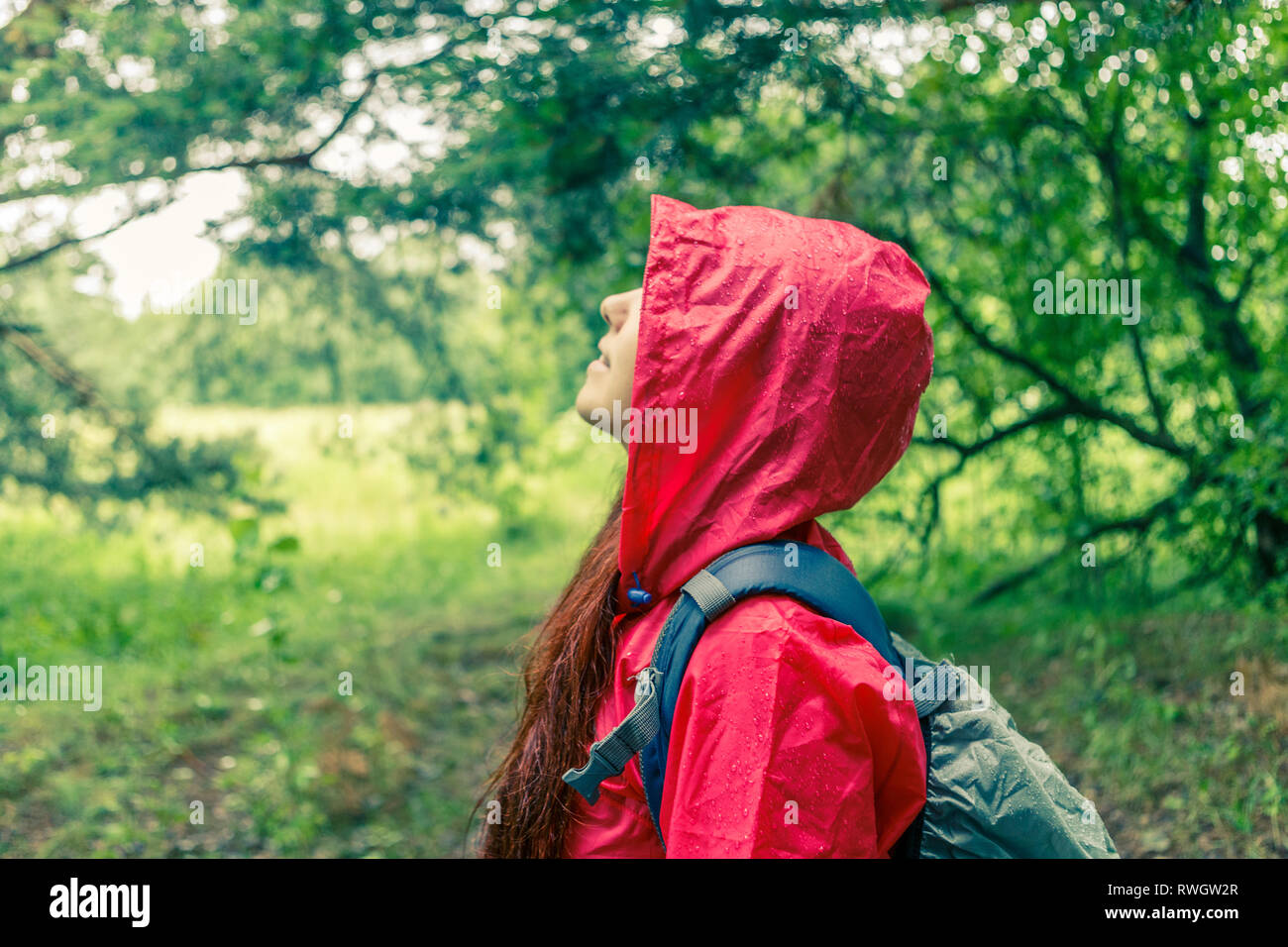 Side view of woman in hood Stock Photo - Alamy