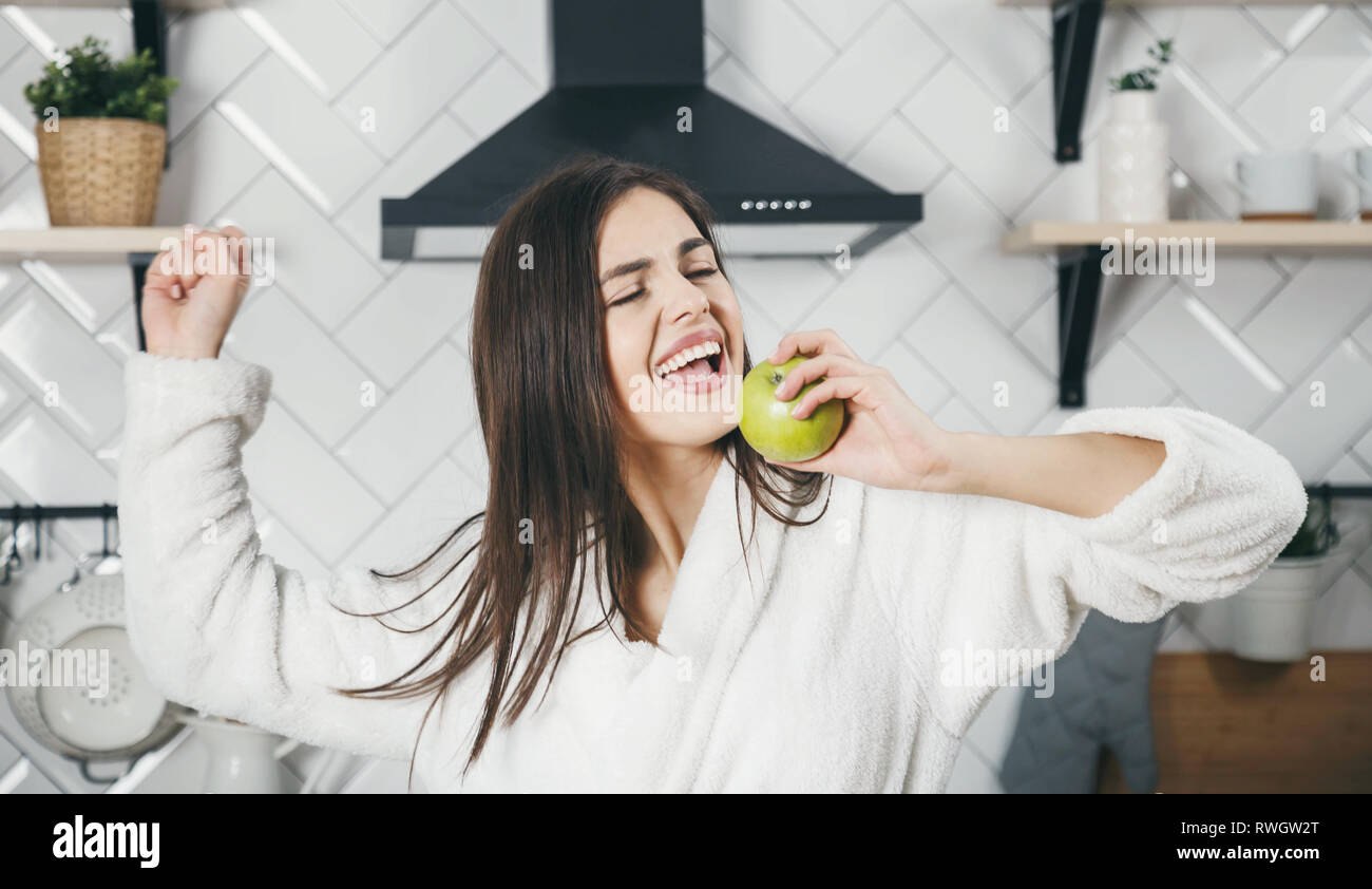 Young adorable woman singing her favorite song Stock Photo - Alamy
