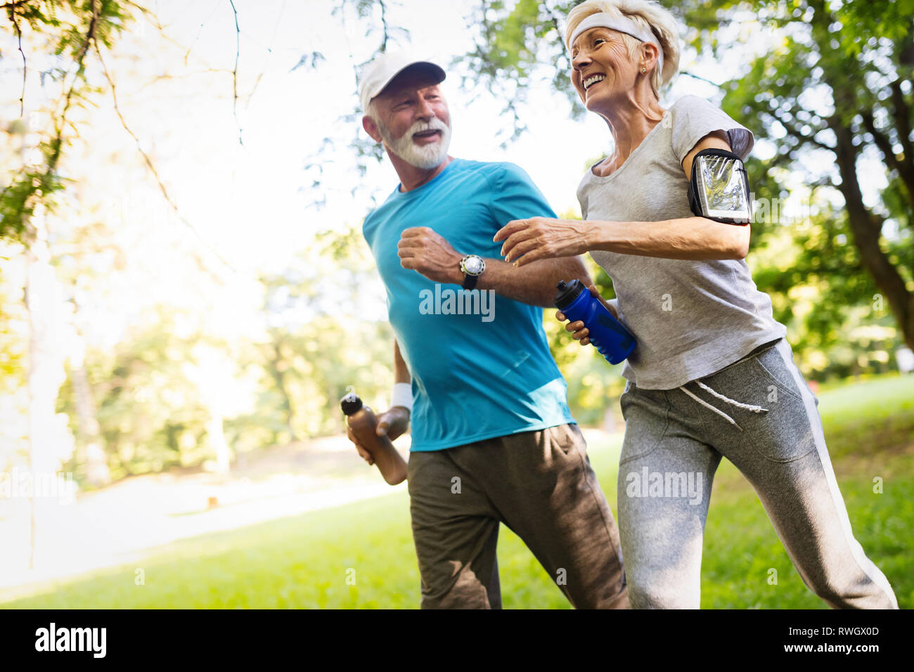 Happy senior people running to stay helathy and lose weight Stock Photo ...
