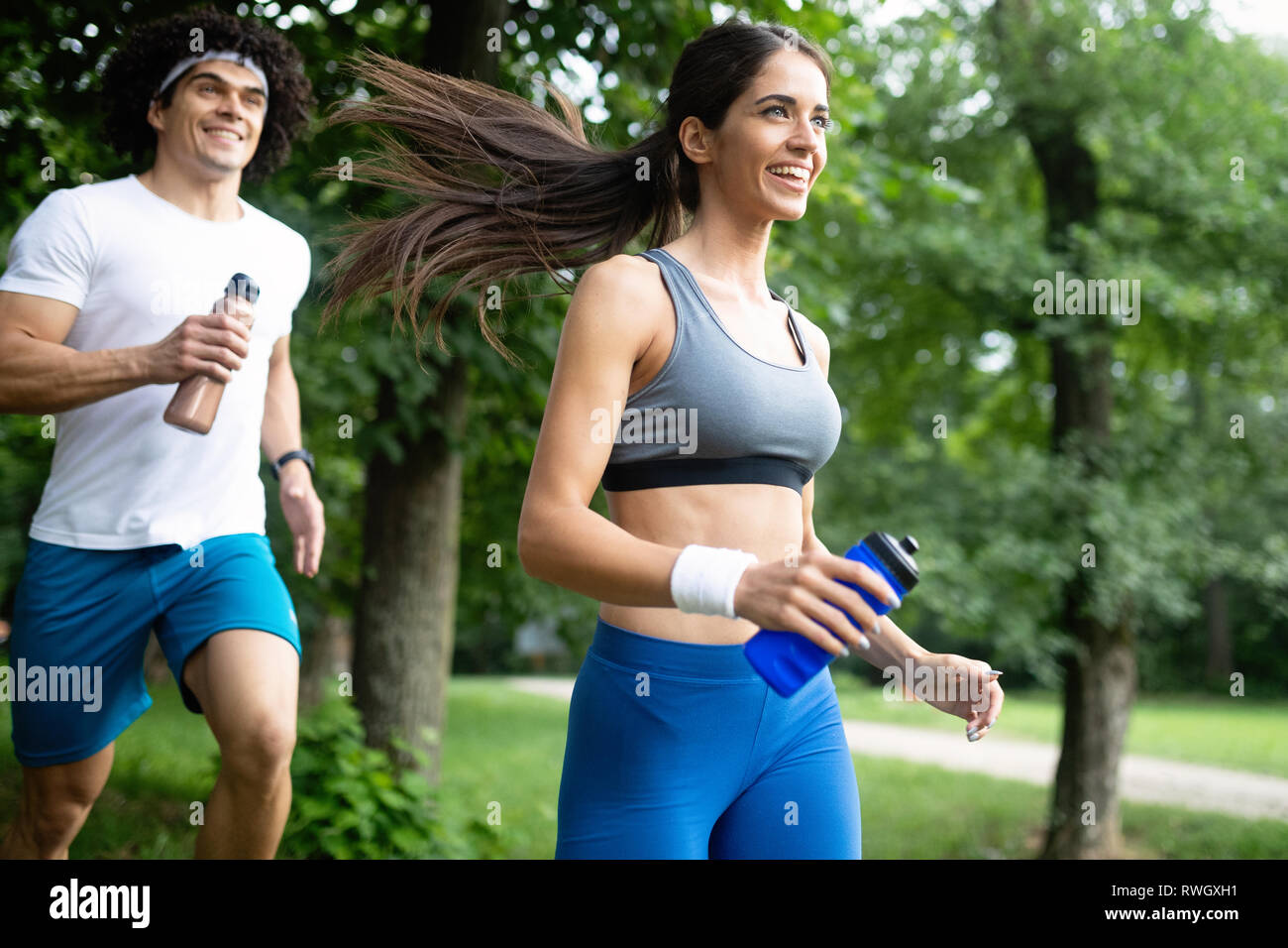 Young man jogging outdoors hi-res stock photography and images - Alamy