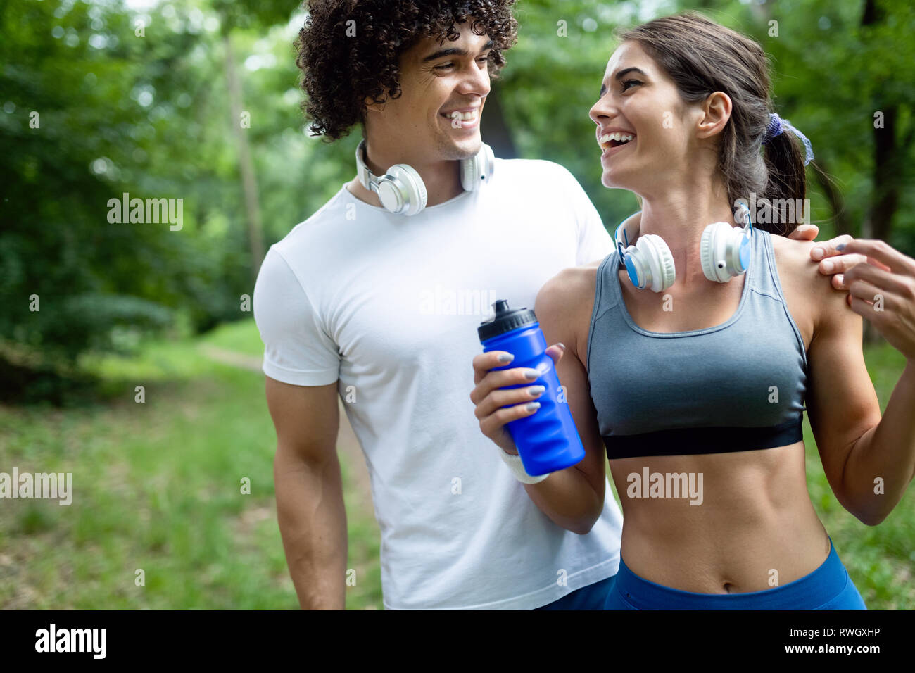 Happy couple running and jogging together outdoor Stock Photo - Alamy