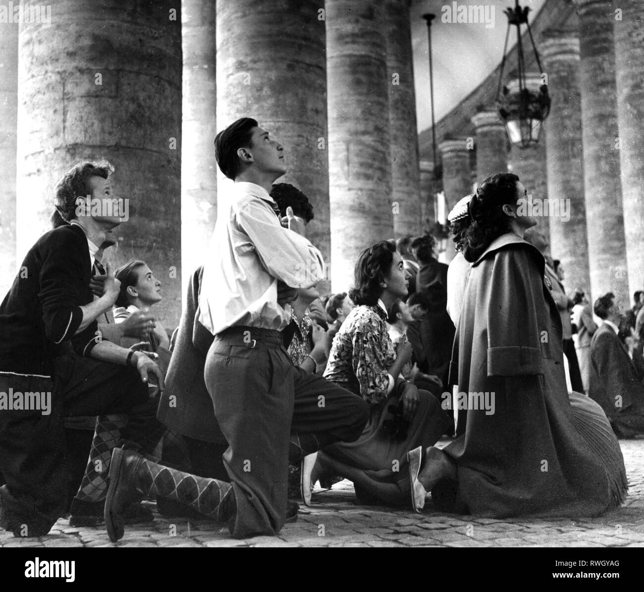 Kneeling praying woman Black and White Stock Photos & Images - Alamy