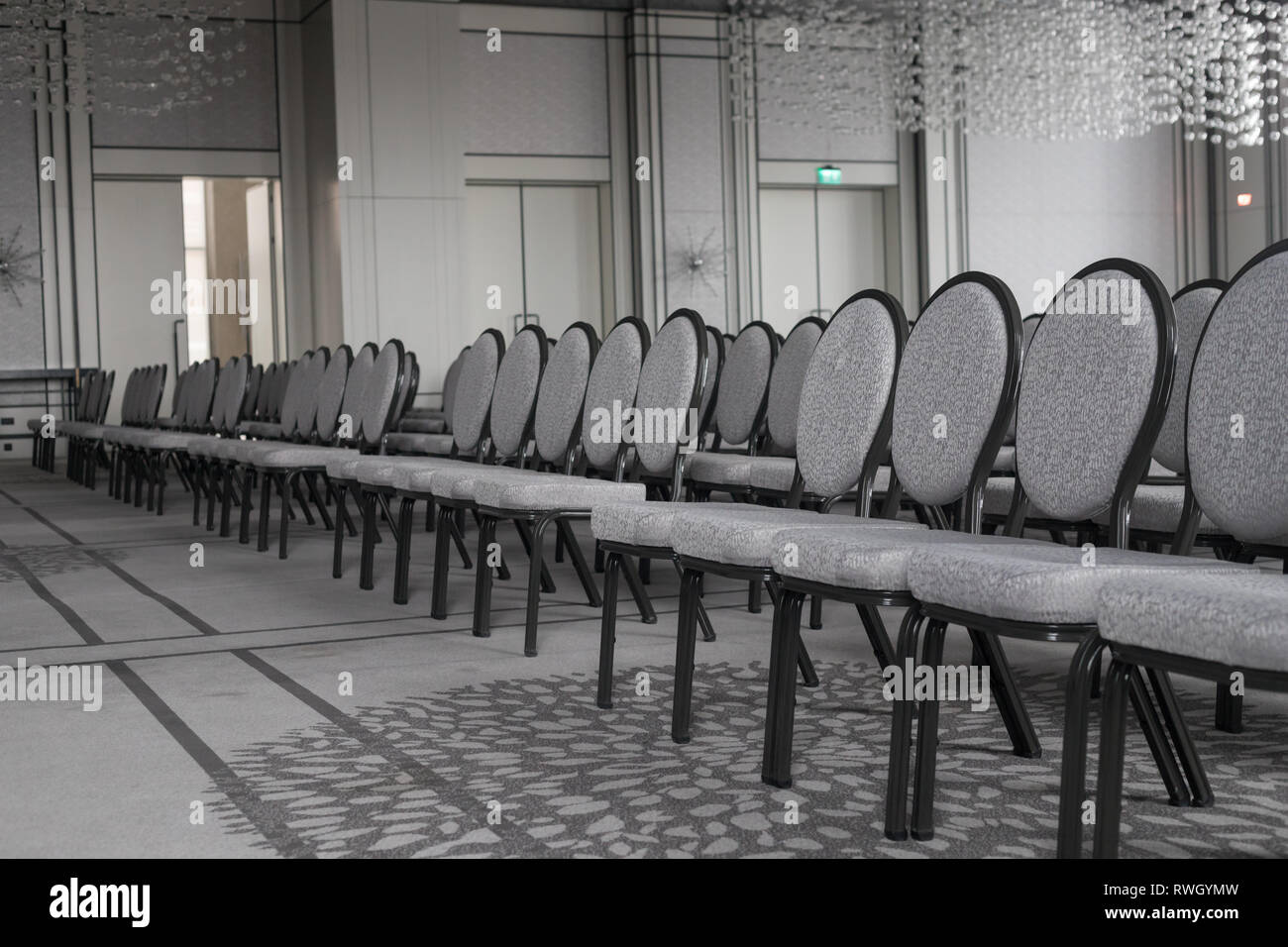 Empty conference hall. Straight rows of chairs. Monochrome Stock Photo ...