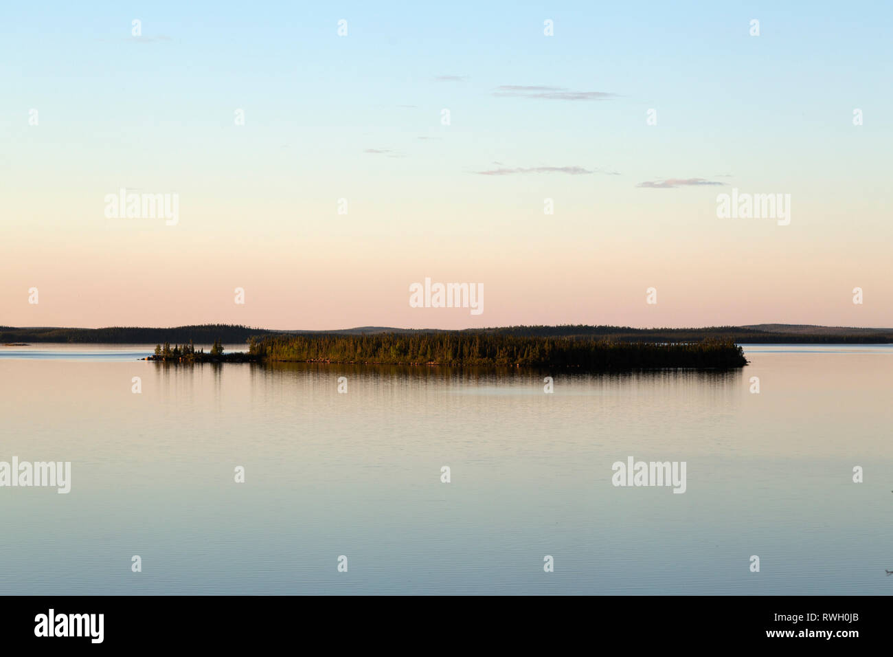 Sundown over Dillabough Lake in northern Manitoba, Canada. The sun ...