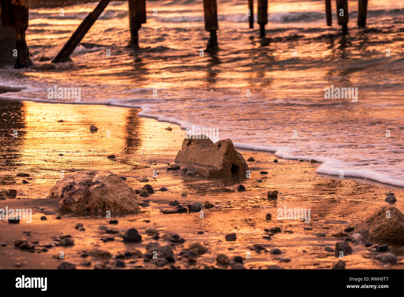rocks on the water at Atlit beach,sunset time, Israel Stock Photo - Alamy