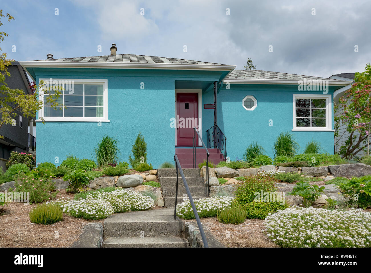 Light blue average residential house built on land terrace Stock Photo ...