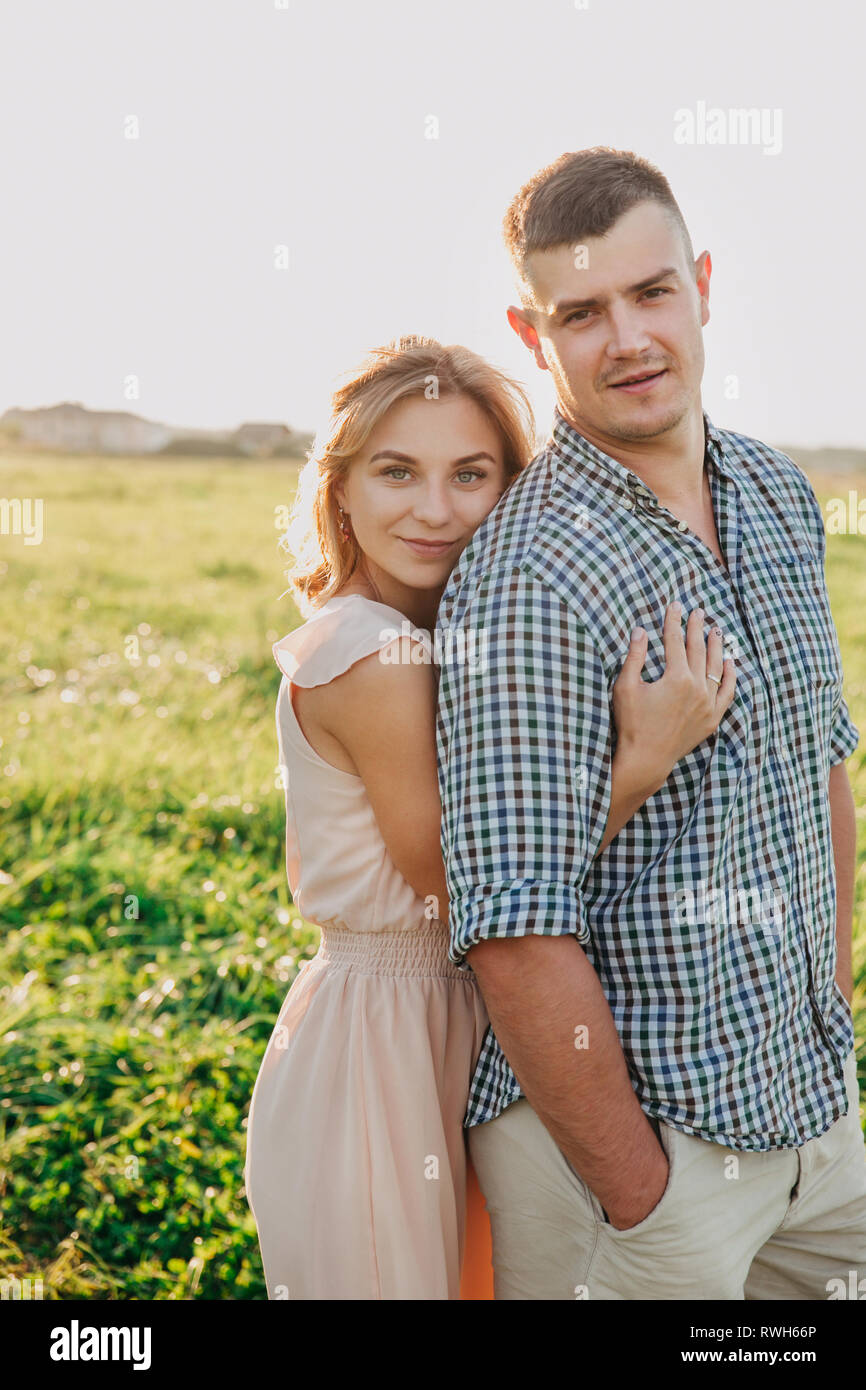 Young couple in love in summer in field.Couple hugging outdoor Stock Photo - Alamy