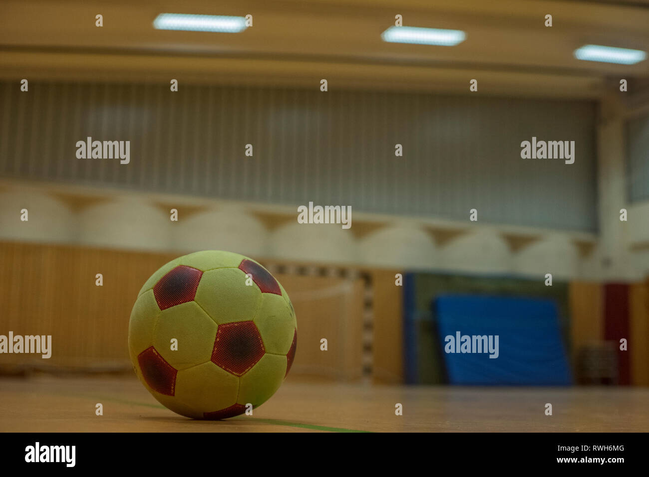 Soccer ball in a modern gym Stock Photo - Alamy